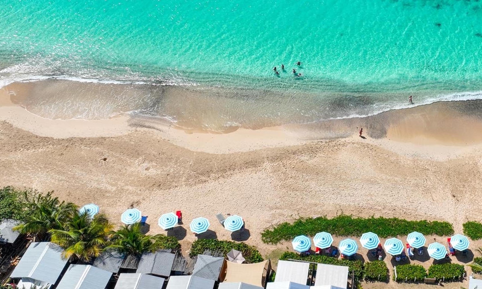 This Tiny New Caribbean Retreat Has Cabins on the Sand, Outdoor Showers ...