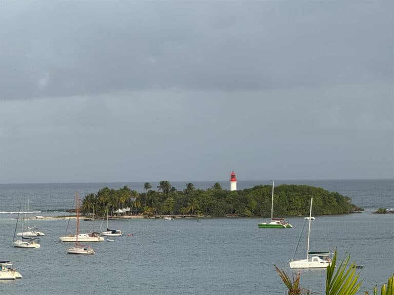This Tiny Caribbean Islet Has a Lighthouse, a Postcard-Perfect Beach ...